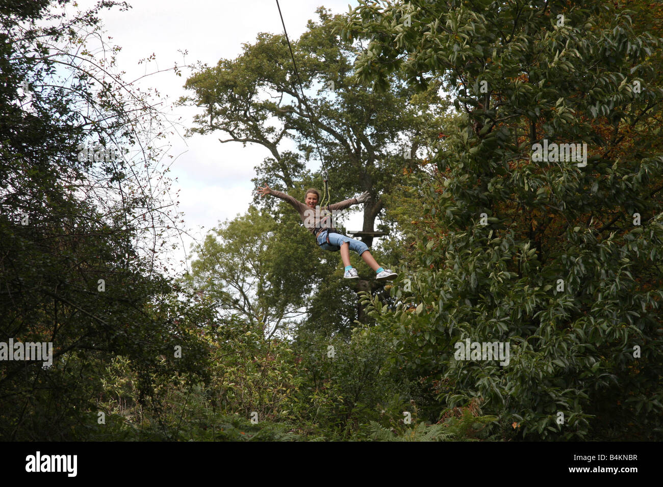 Girl on a zip wire Stock Photo - Alamy