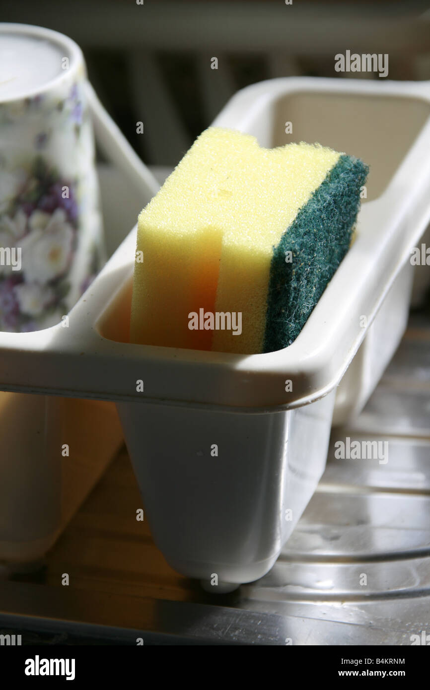 one washing up scourer sponge on kichen sink Stock Photo - Alamy