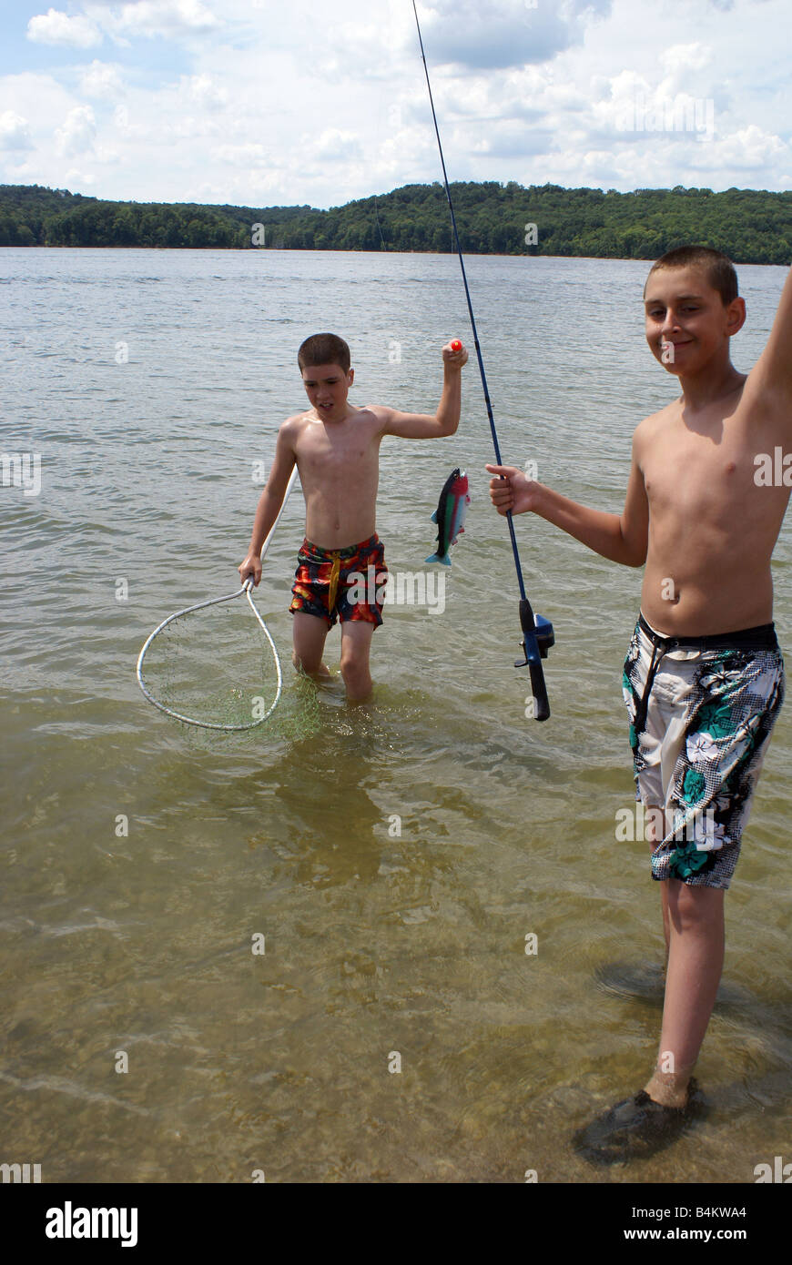 Children reel in fish lake hi-res stock photography and images - Alamy