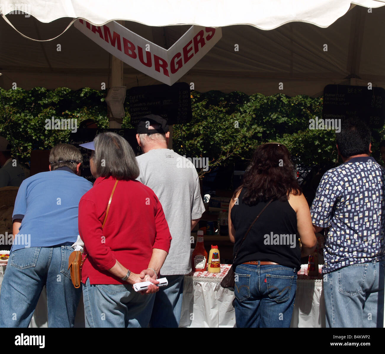 Crowd of people at the food tent at an arts and crafts fair in New York ...