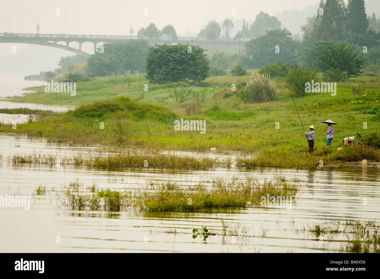 Chinese people fishing in a river, Leshan, China Stock Photo - Alamy