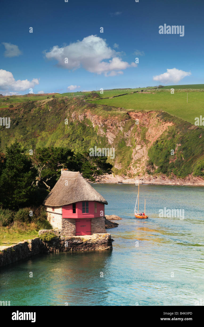 pretty pink boathouse in devon Stock Photo - Alamy
