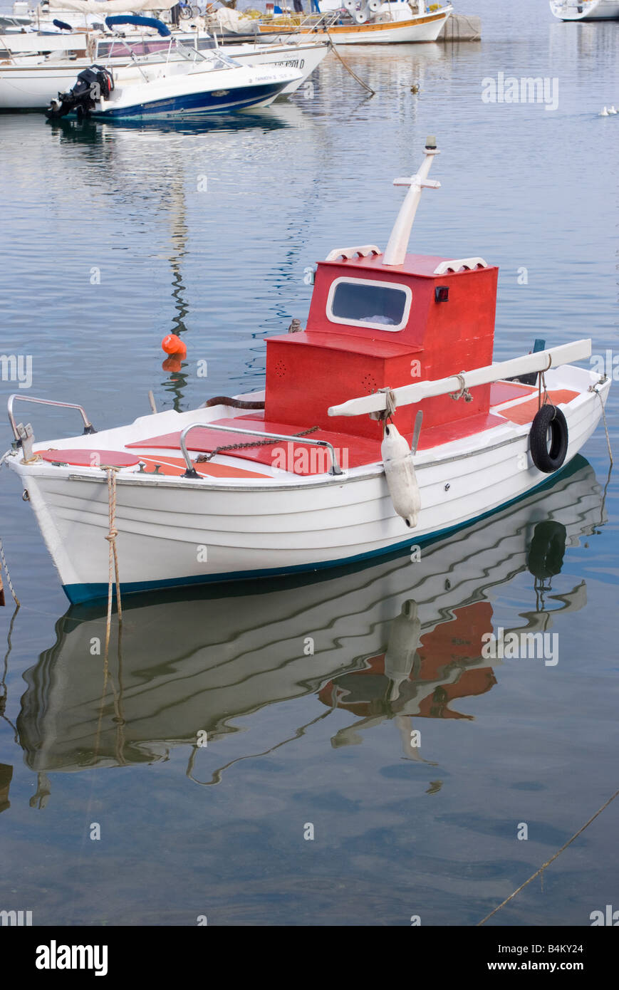 A Small Greek Fishing Boat Moored in the Harbour at Foinix Town Isle of ...