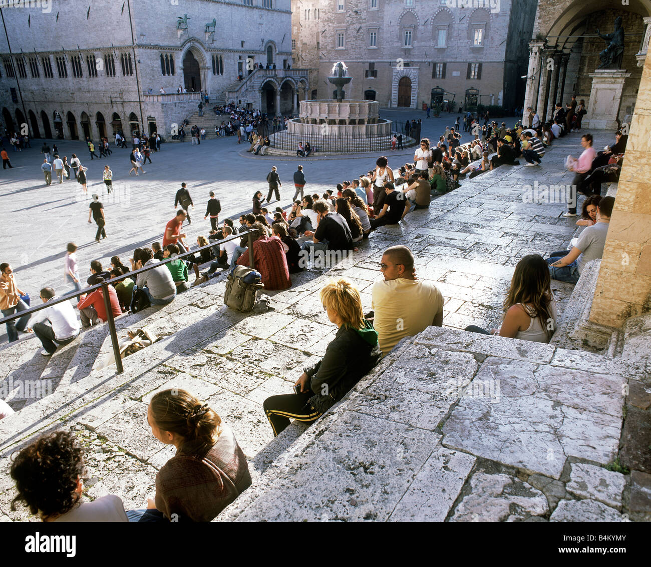 Evening crowds hanging out on the steps of the Duomo di San Lorenzo in ...