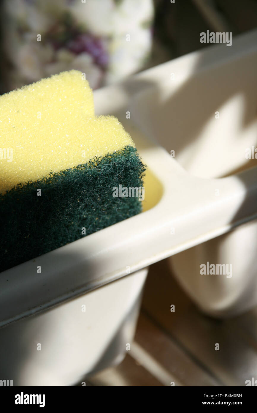 one washing up scourer sponge on kichen sink Stock Photo - Alamy