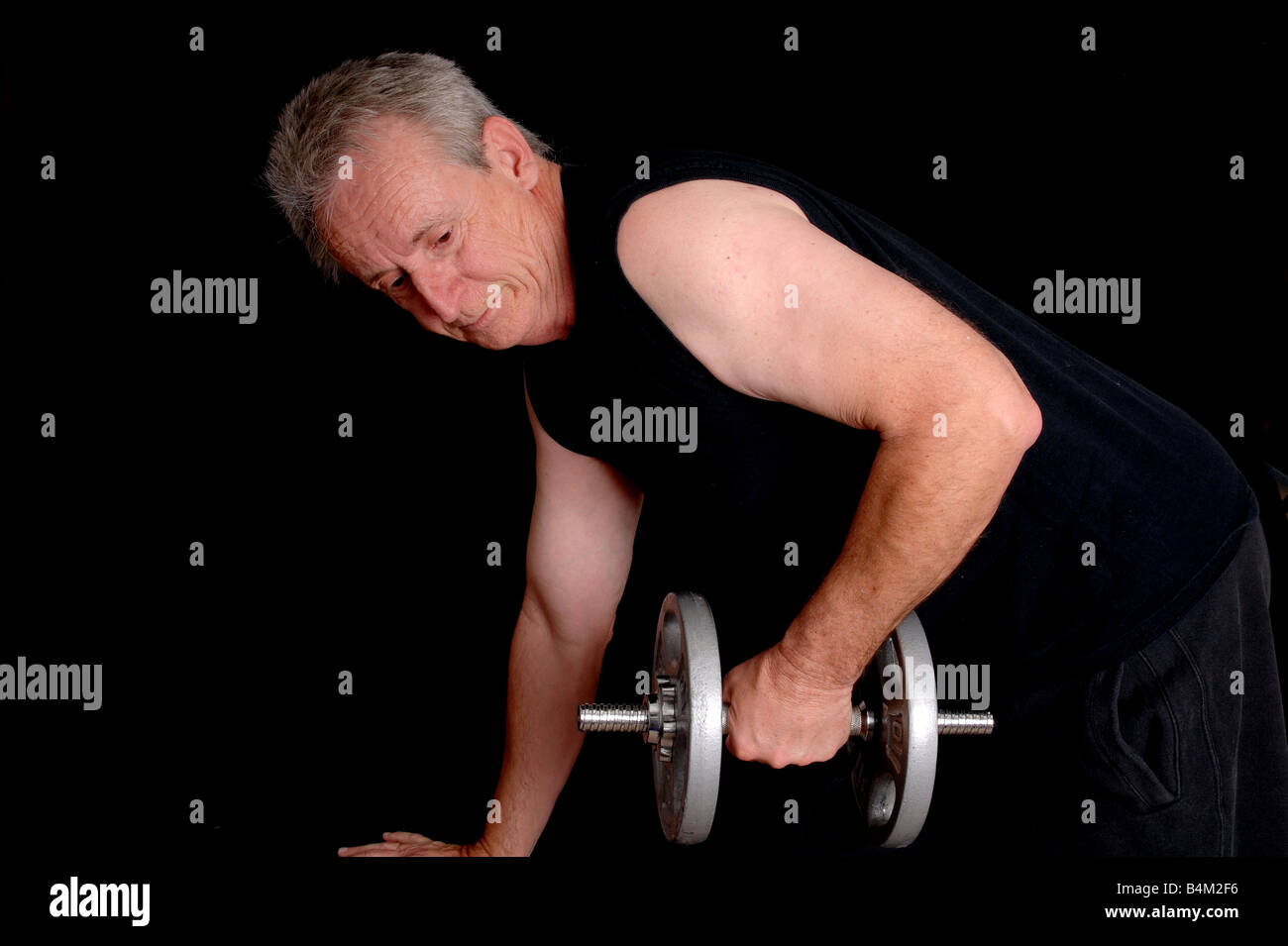Senior man flexing muscle hi-res stock photography and images - Alamy