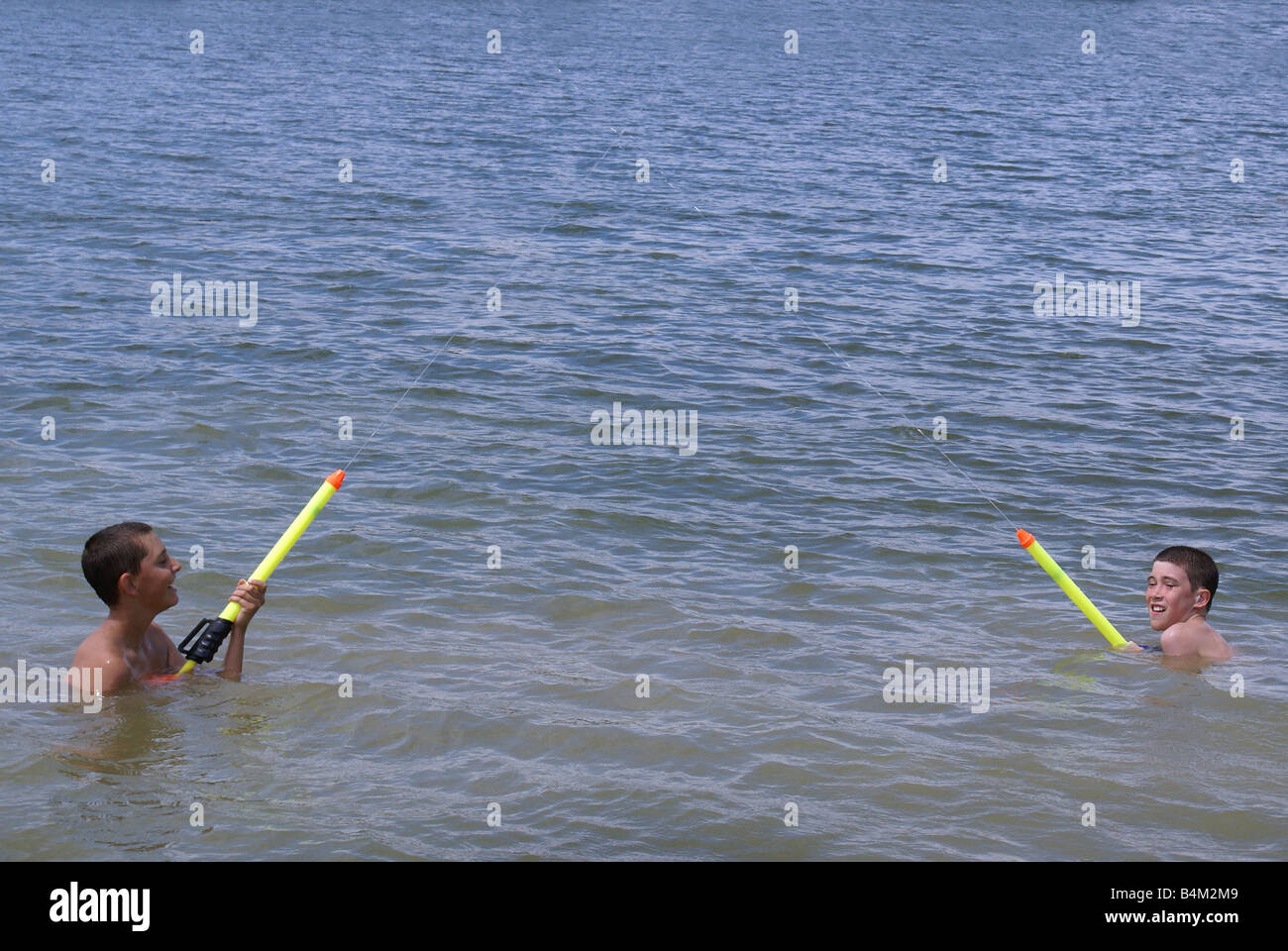 Children playing water fight hi-res stock photography and images - Alamy