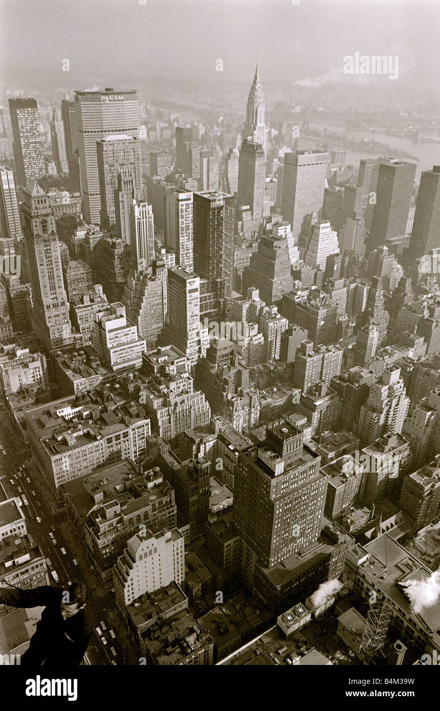 Window Cleaners a 1000 foot above the side walk cleaning the windows of ...