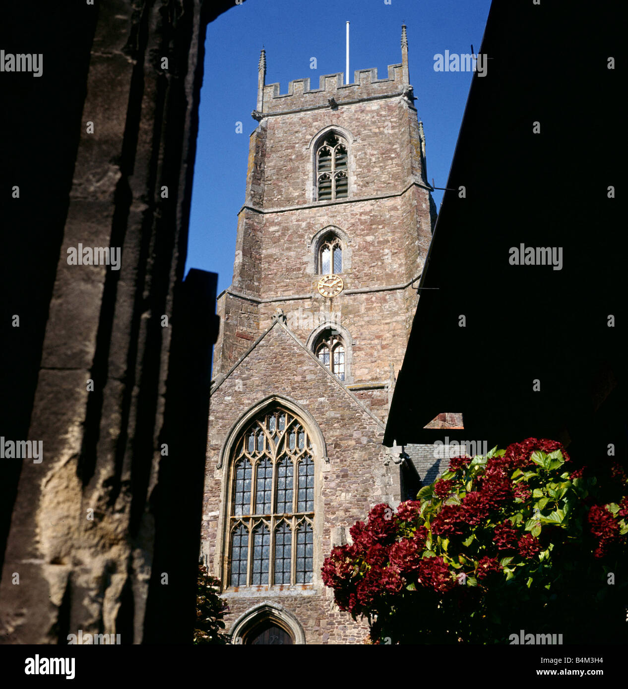 St George s Church Dunster in Somerset Church Tower Clock Flowers Rural ...