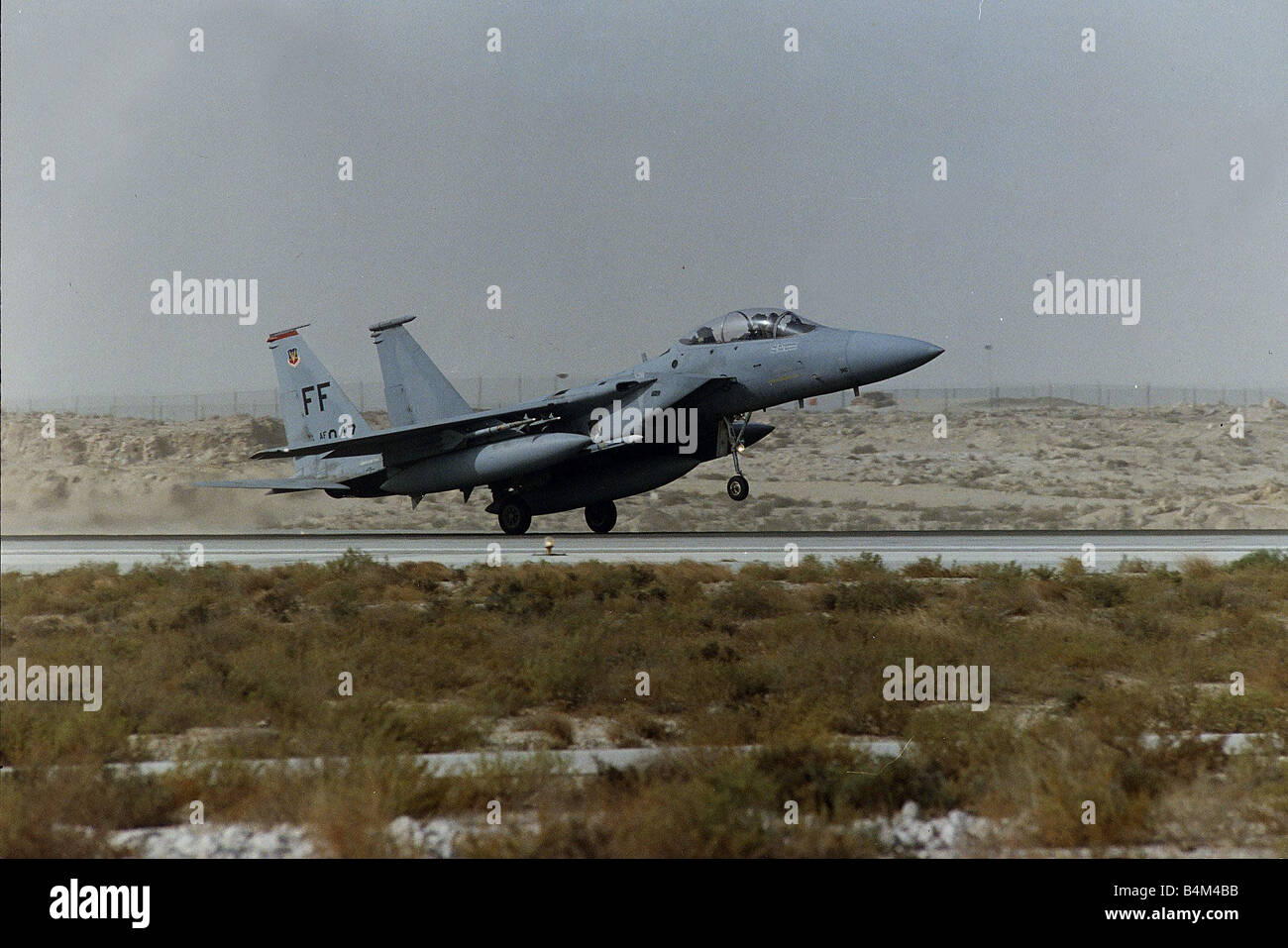 A McDonnell Douglas F15 Eagle of the USAF lands on a desert runway ...