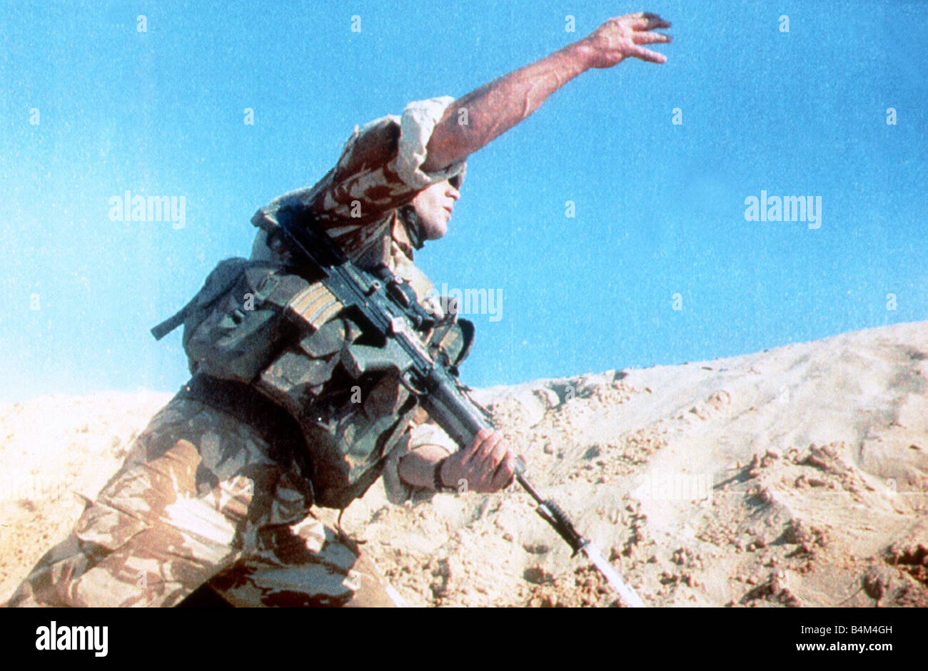 A member of the Desert Rats throwing a grenade during a training ...