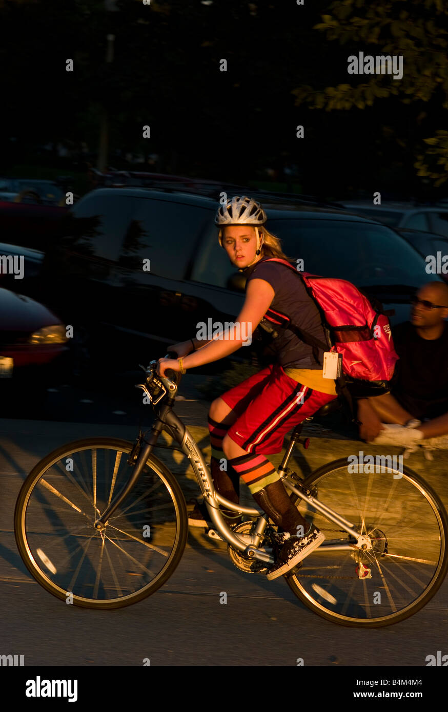 Football player riding bicycle Stock Photo - Alamy