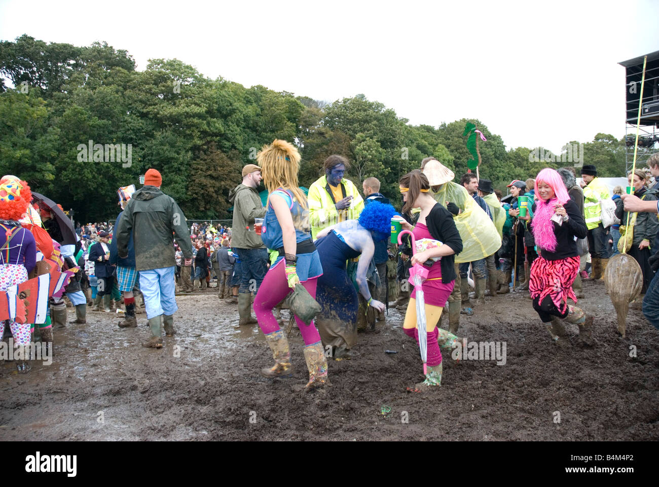 People dressed up dancing in the mud, Bestival, Isle of Wight, UK 2008 ...