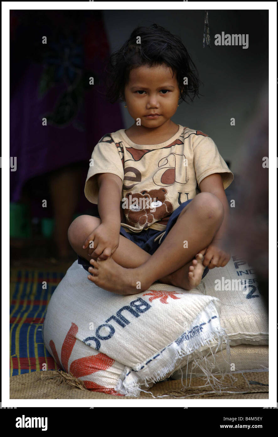 Tsunami Disaster in Indonesia January 2005 Aech a refugee child sits on ...