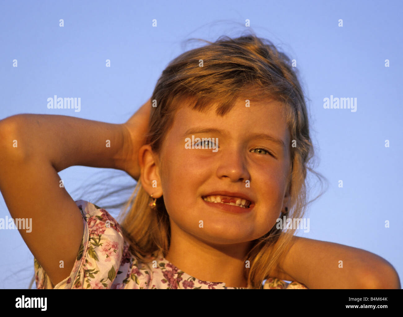 Girl without teeth smiling Stock Photo - Alamy