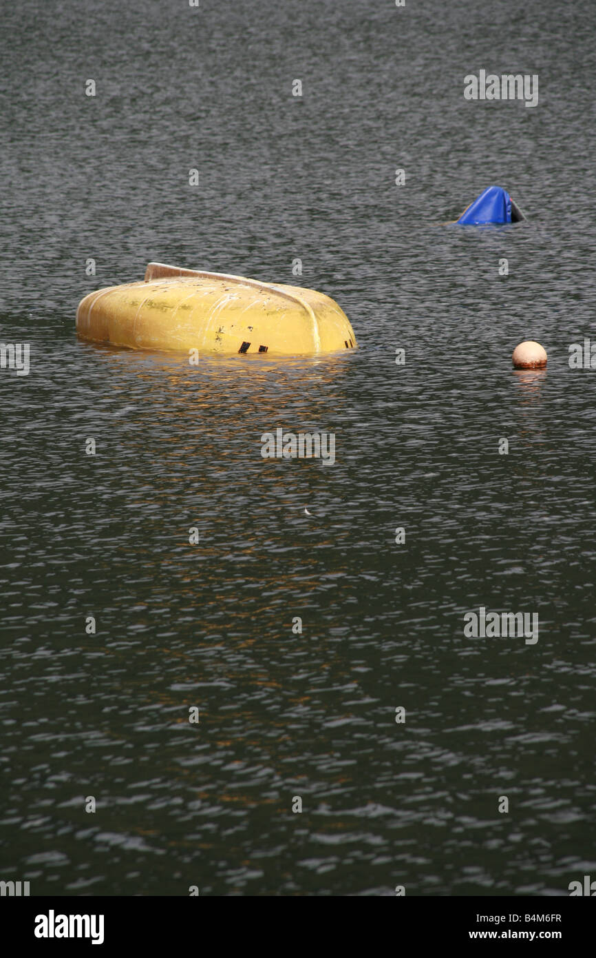 two sinking boats on tourist boating lake Stock Photo - Alamy