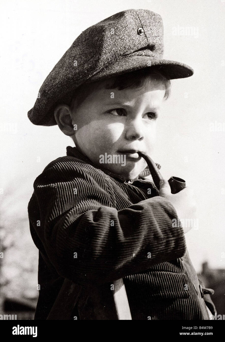 Little boy smoking a pipe circa 1950 Stock Photo - Alamy
