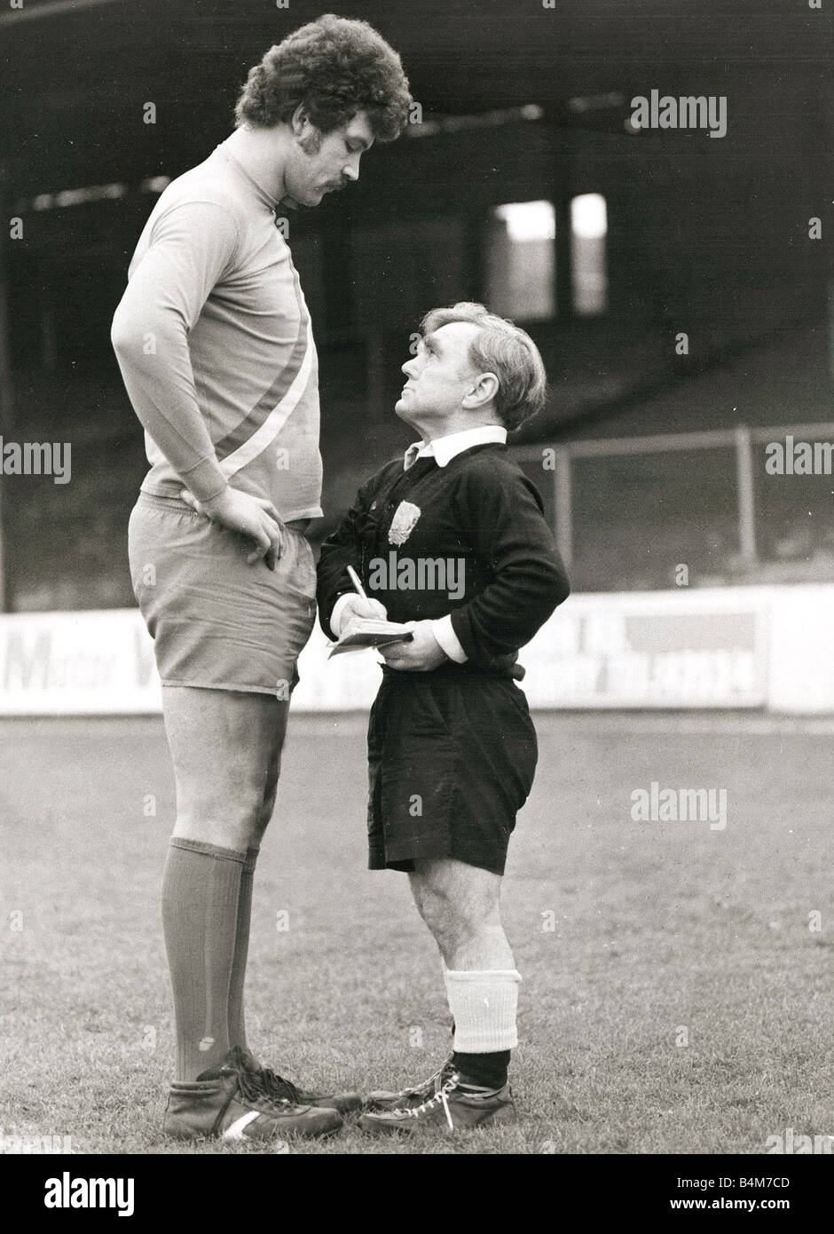 Pocket sized referee telling off a tall footballer at Reading in ...