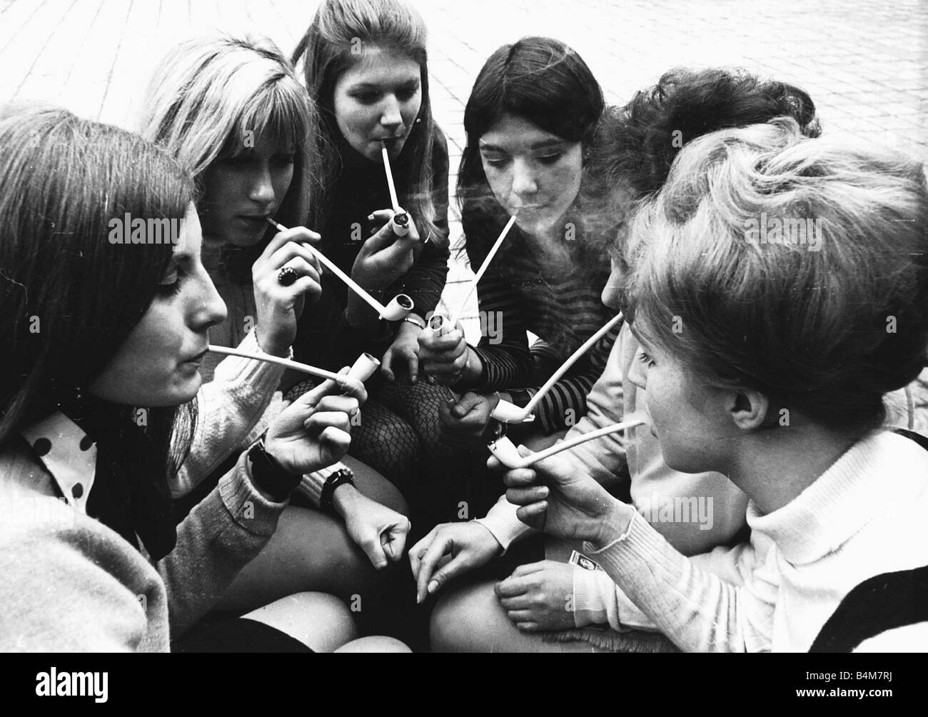 Female students smoke pipes for a contest in 1969 Stock Photo - Alamy