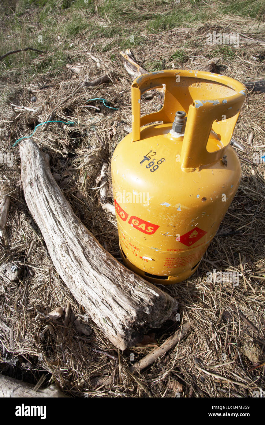 Dumped gas bottle Stock Photo - Alamy