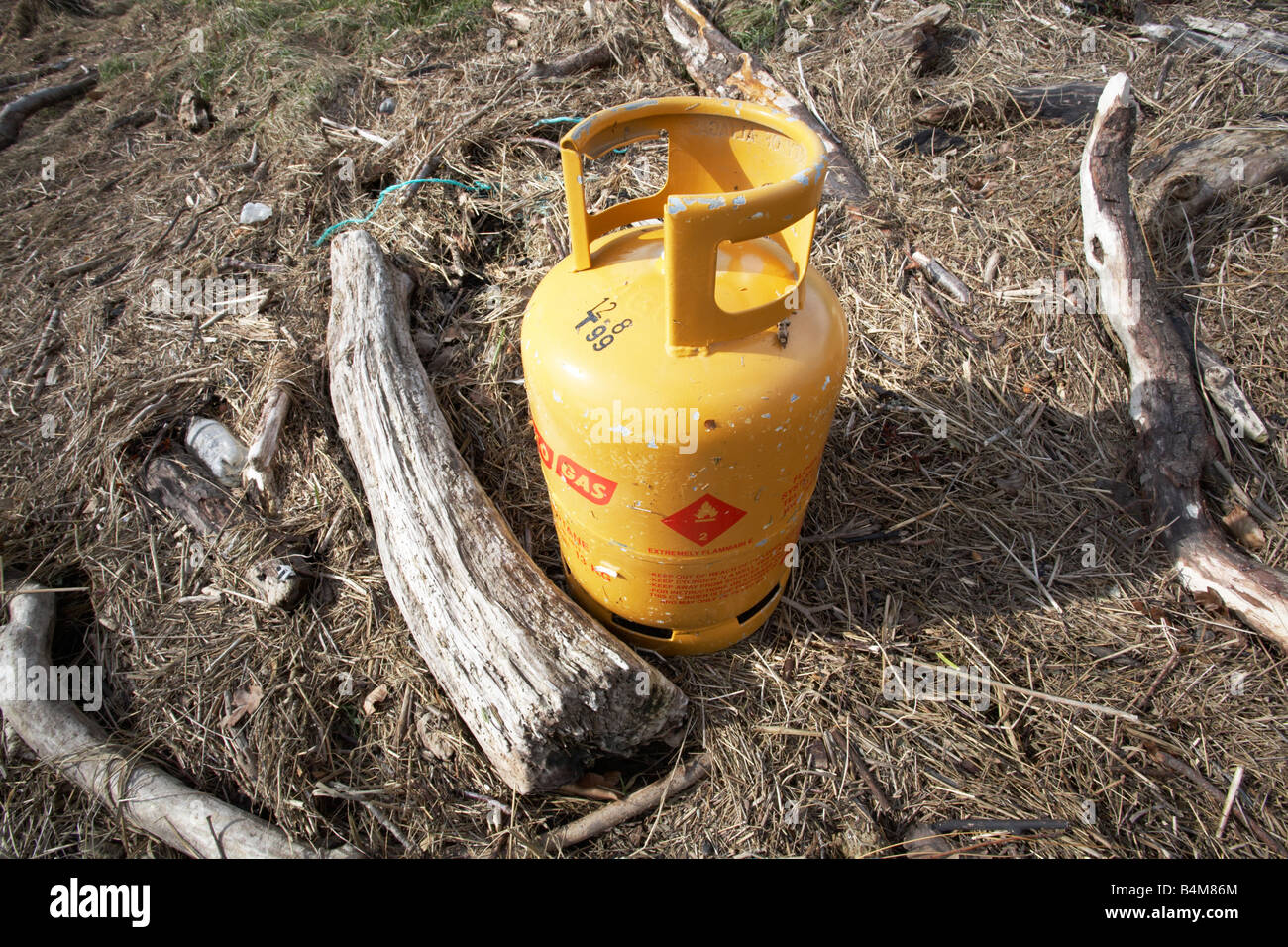 Dumped gas bottle Stock Photo - Alamy