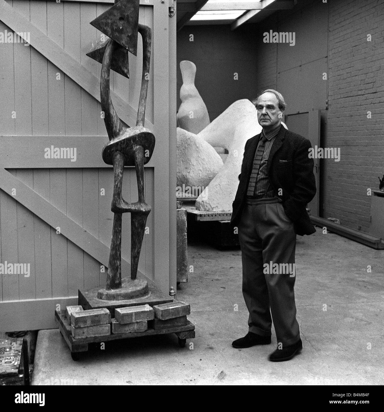 Henry Moore Artist and Sculpture 1963 outside his studio with his work ...