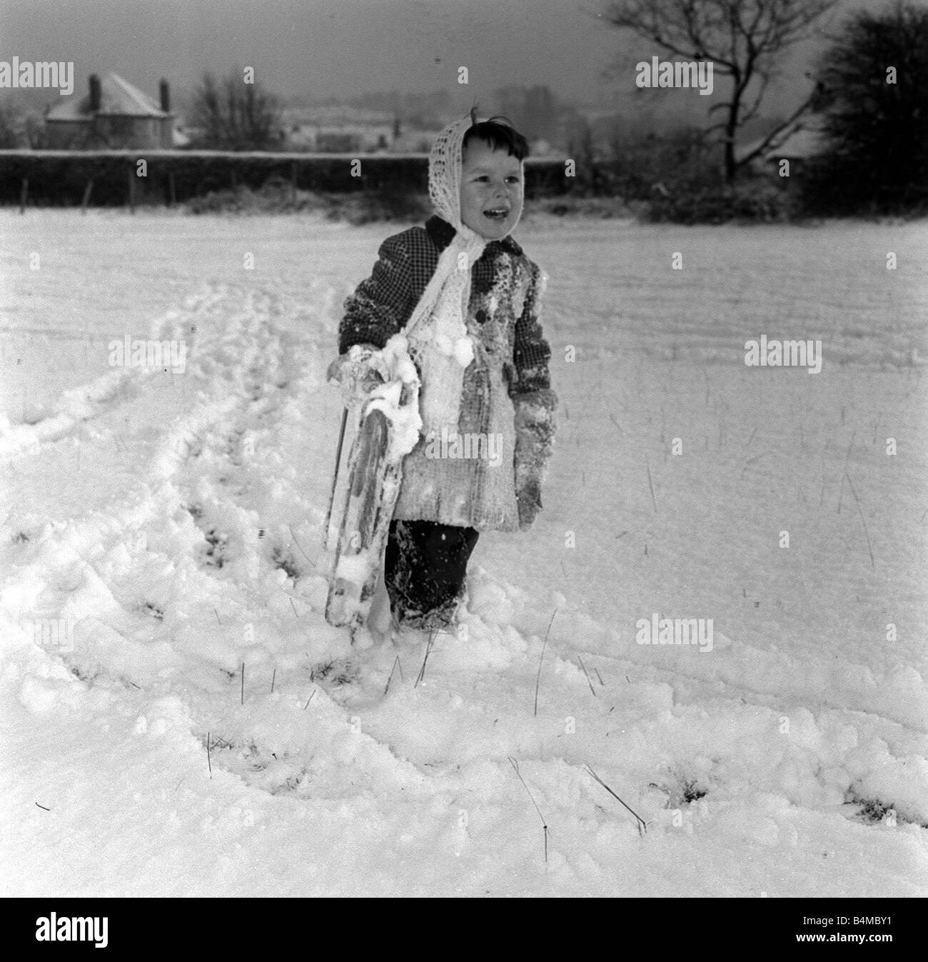 1960s playing in the snow hi-res stock photography and images - Alamy