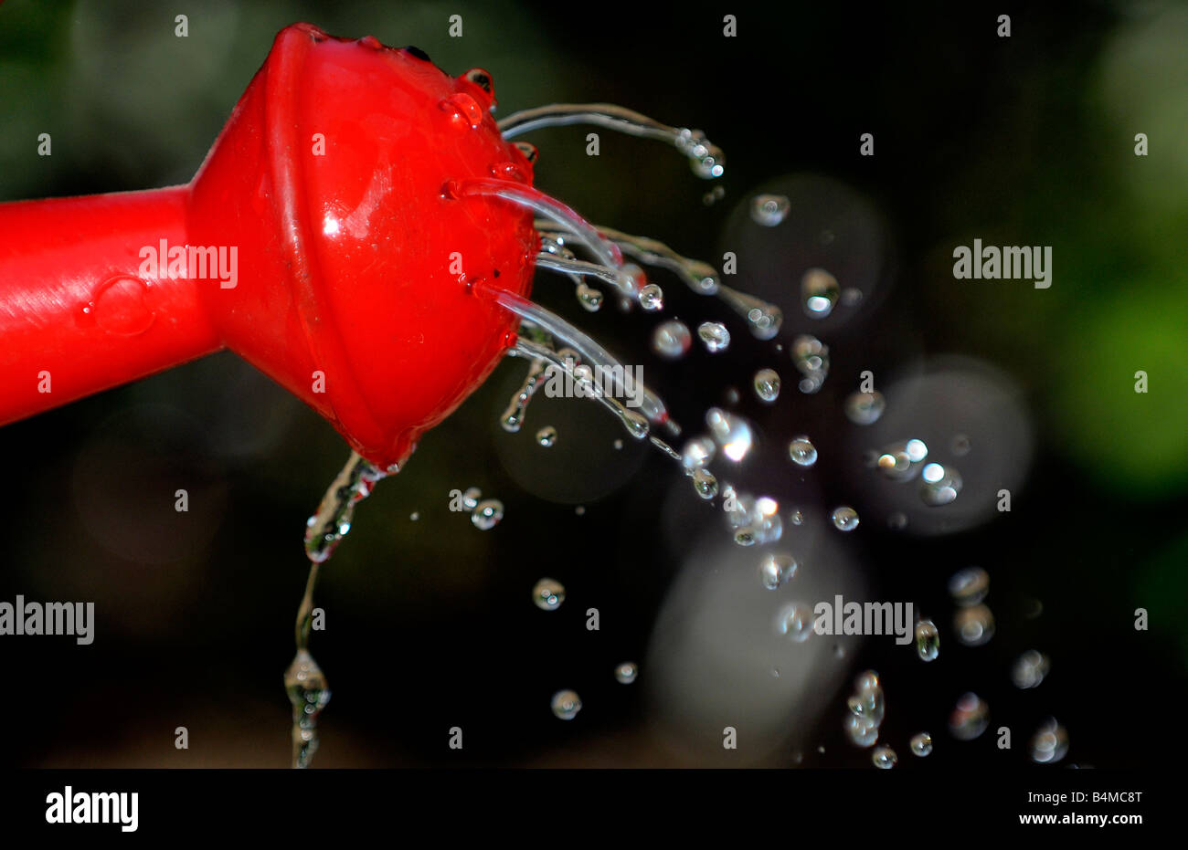 Watering Can With Water Coming Out