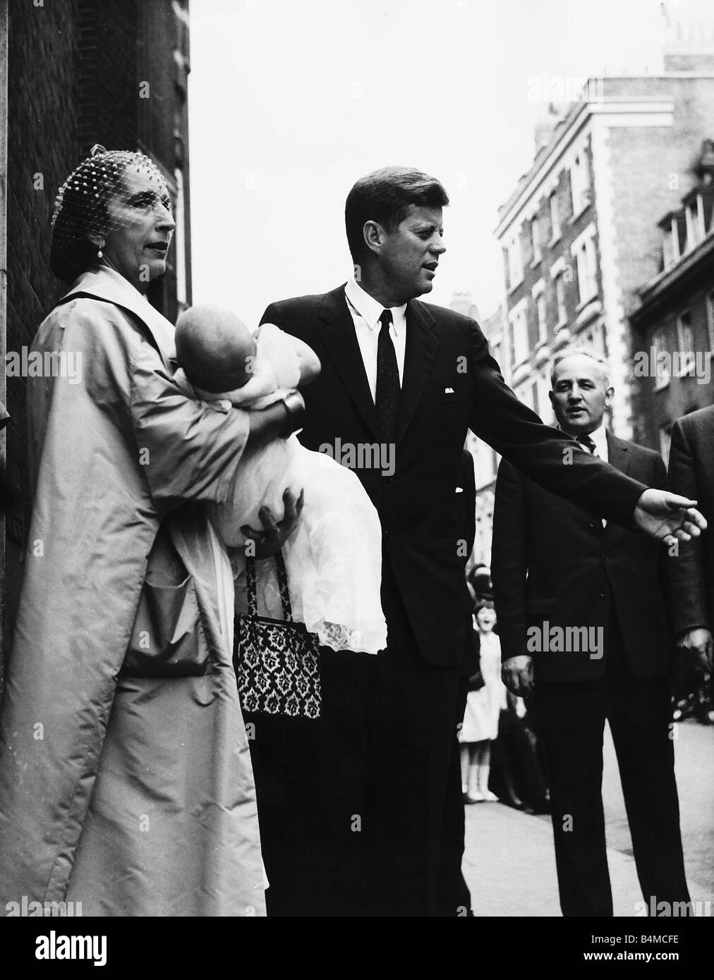 John F Kennedy after the christening of Anna Christina Radziwill who is ...