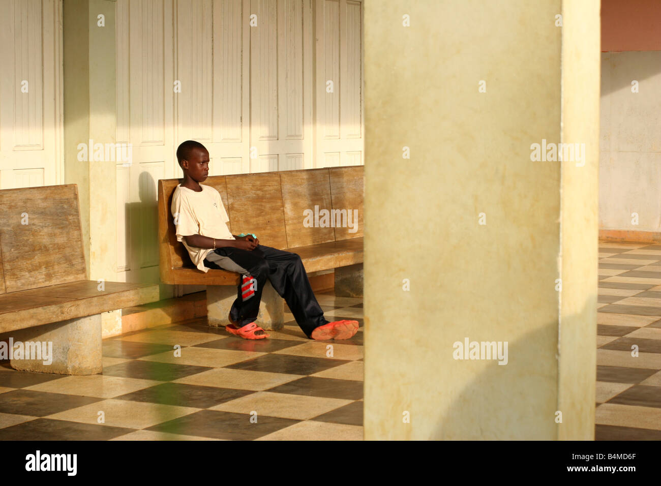 Boy Waiting For Someone