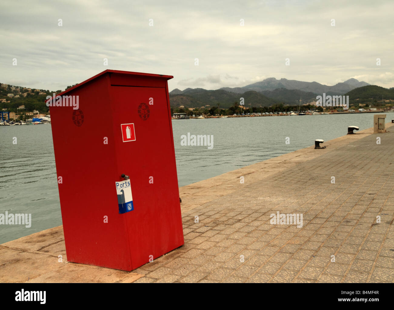 A red fire extinguisher box on a marina wall Stock Photo - Alamy