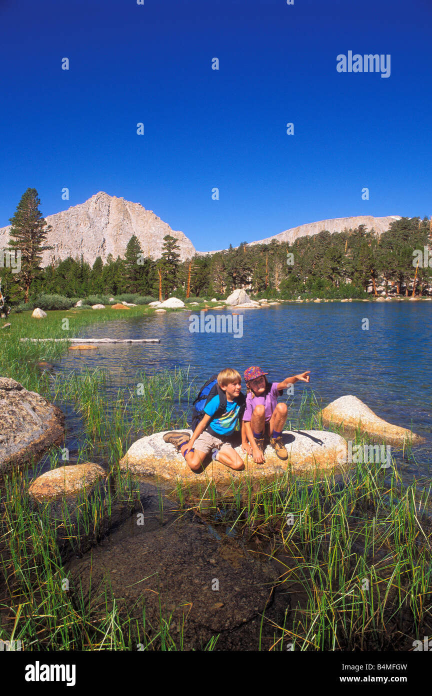 Kids relaxing on the shore of Muir Lake John Muir Wilderness Inyo ...