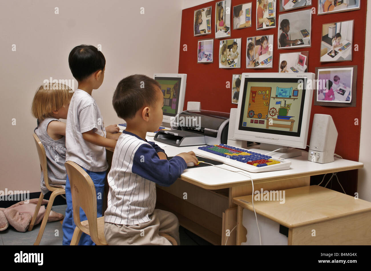 Kindergarden kids learning with computers Stock Photo - Alamy
