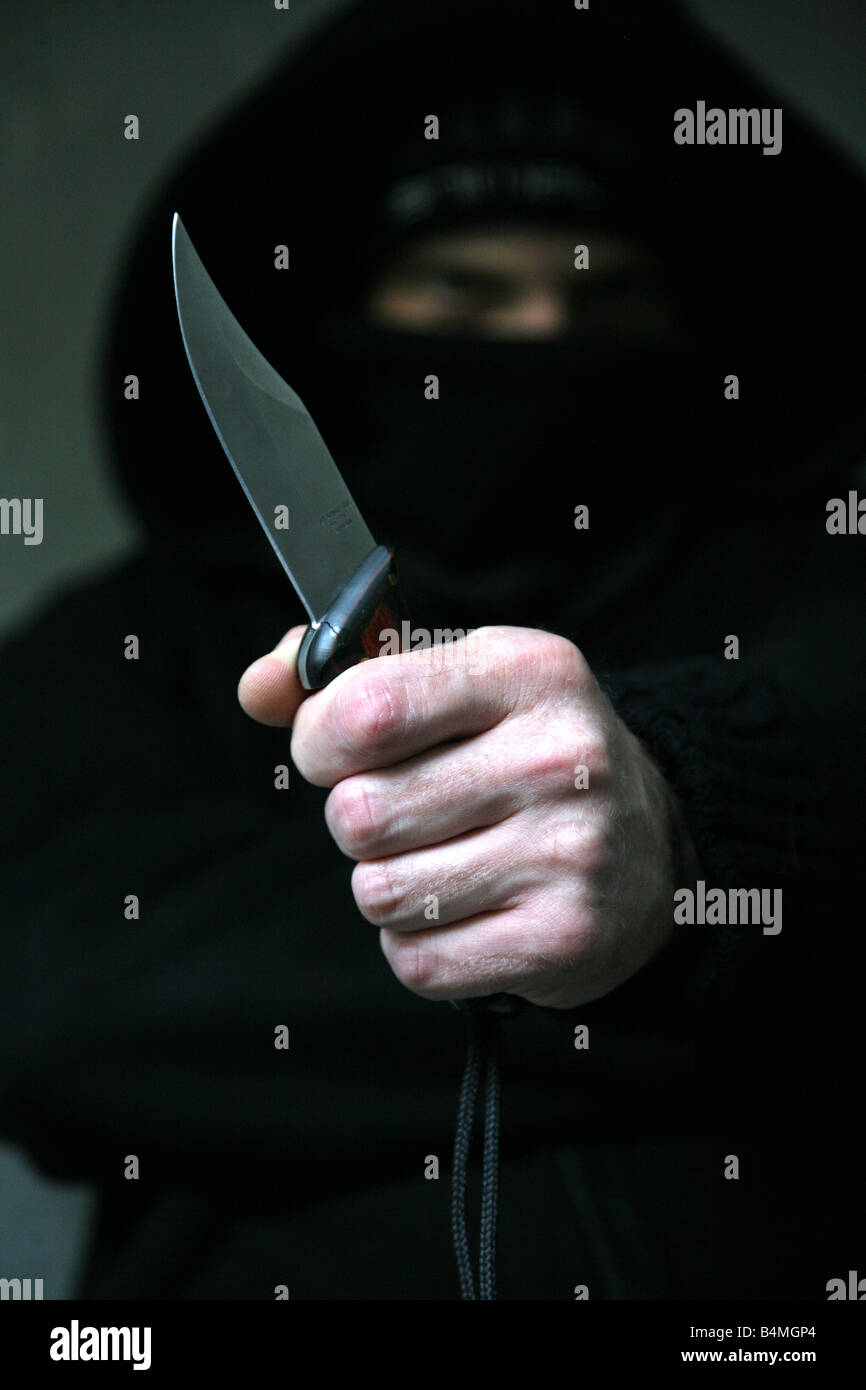 man holding knife Stock Photo - Alamy