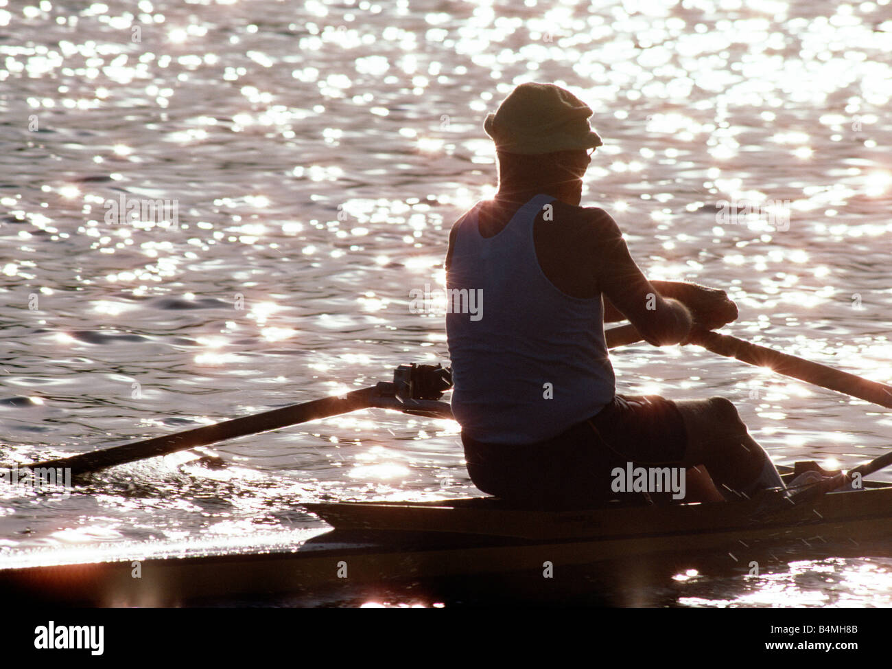 Sculler rowing on the Schuylkill River Stock Photo - Alamy
