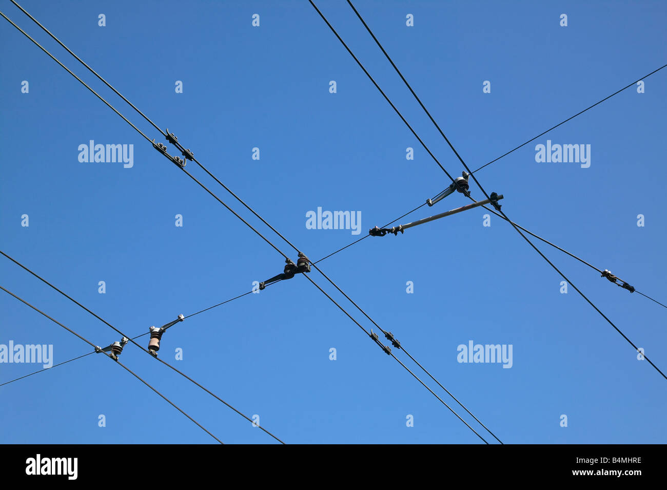 Tram power cables against blue sky Stock Photo - Alamy