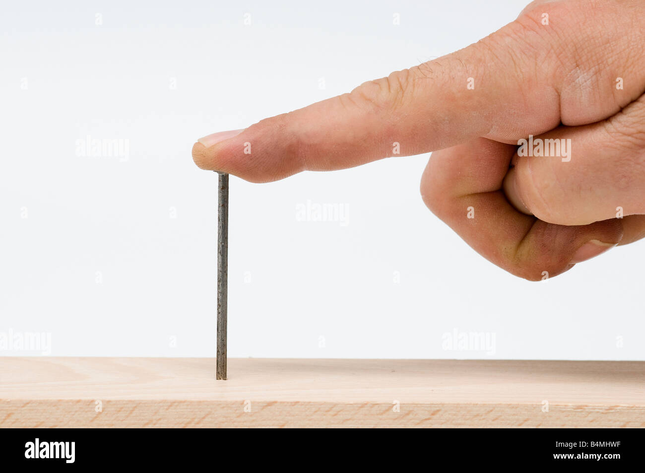drive a nail with your hand Stock Photo - Alamy