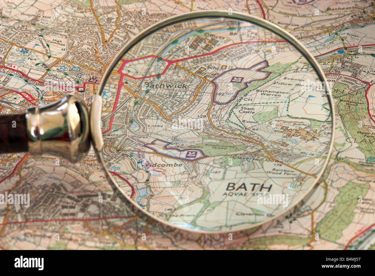 Ordnance Survey Map of Bath partly seen through a brass magnifying ...