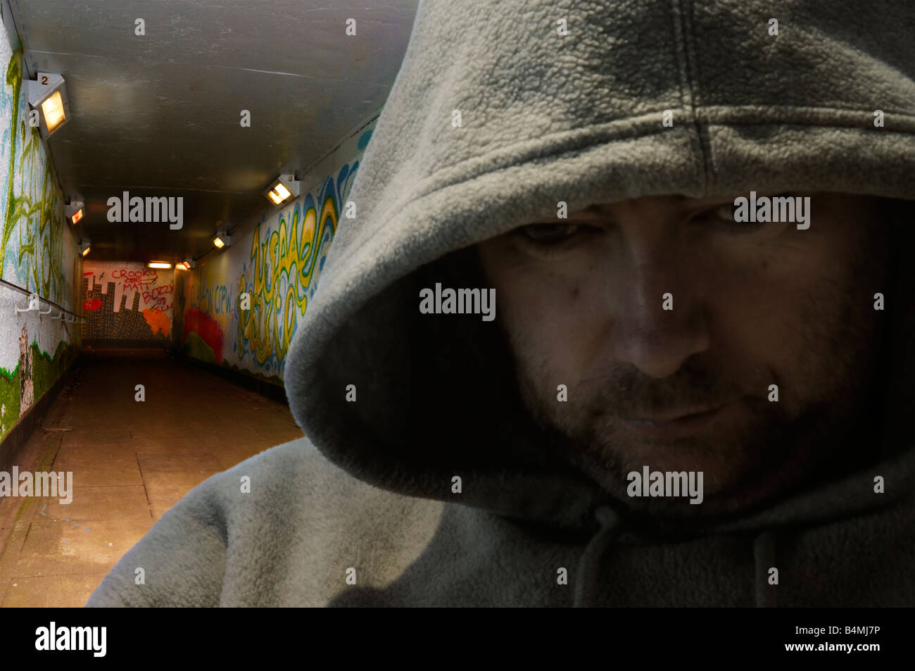Portrait of man in hoody looking sinister deliberately dark Stock Photo ...