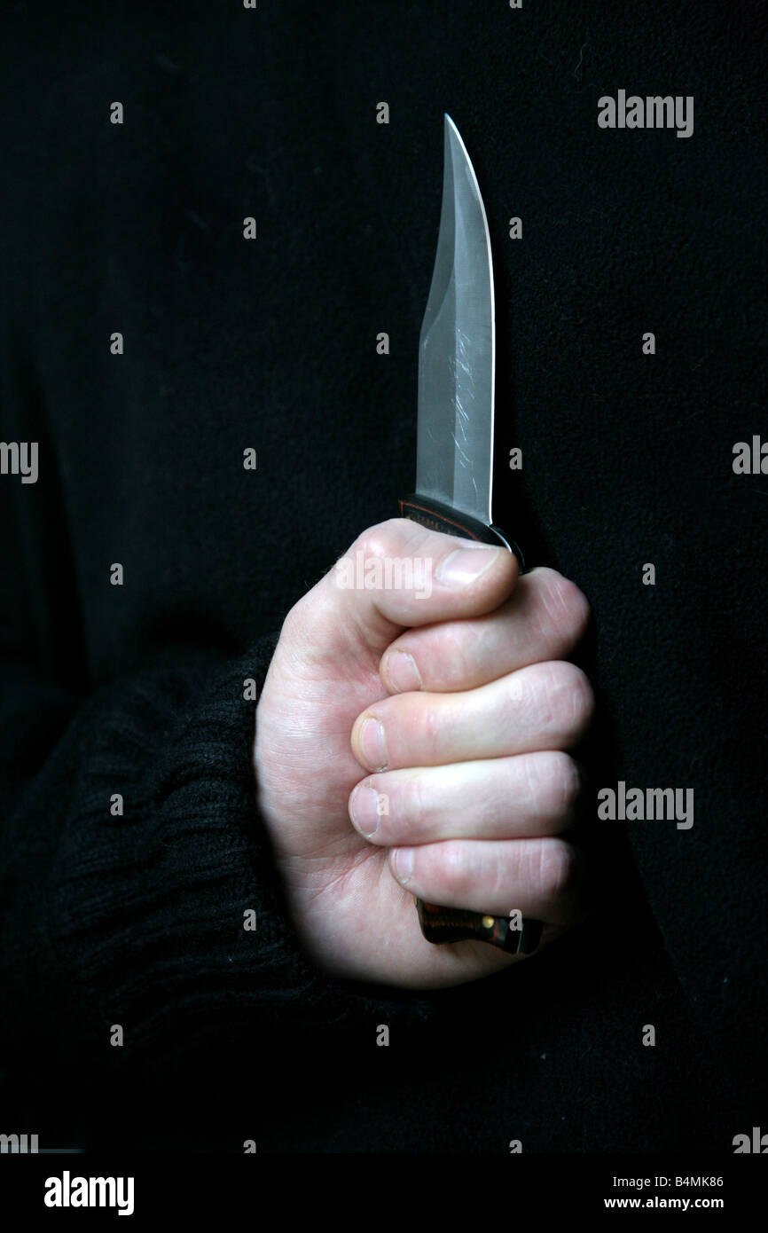 man holding knife Stock Photo - Alamy