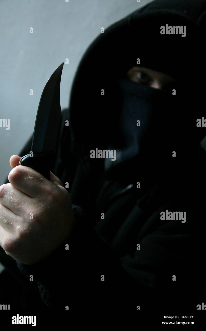 man holding knife Stock Photo - Alamy