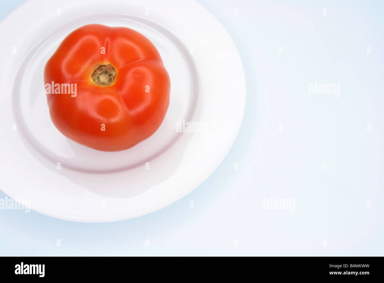 Tomato on Plate Stock Photo - Alamy