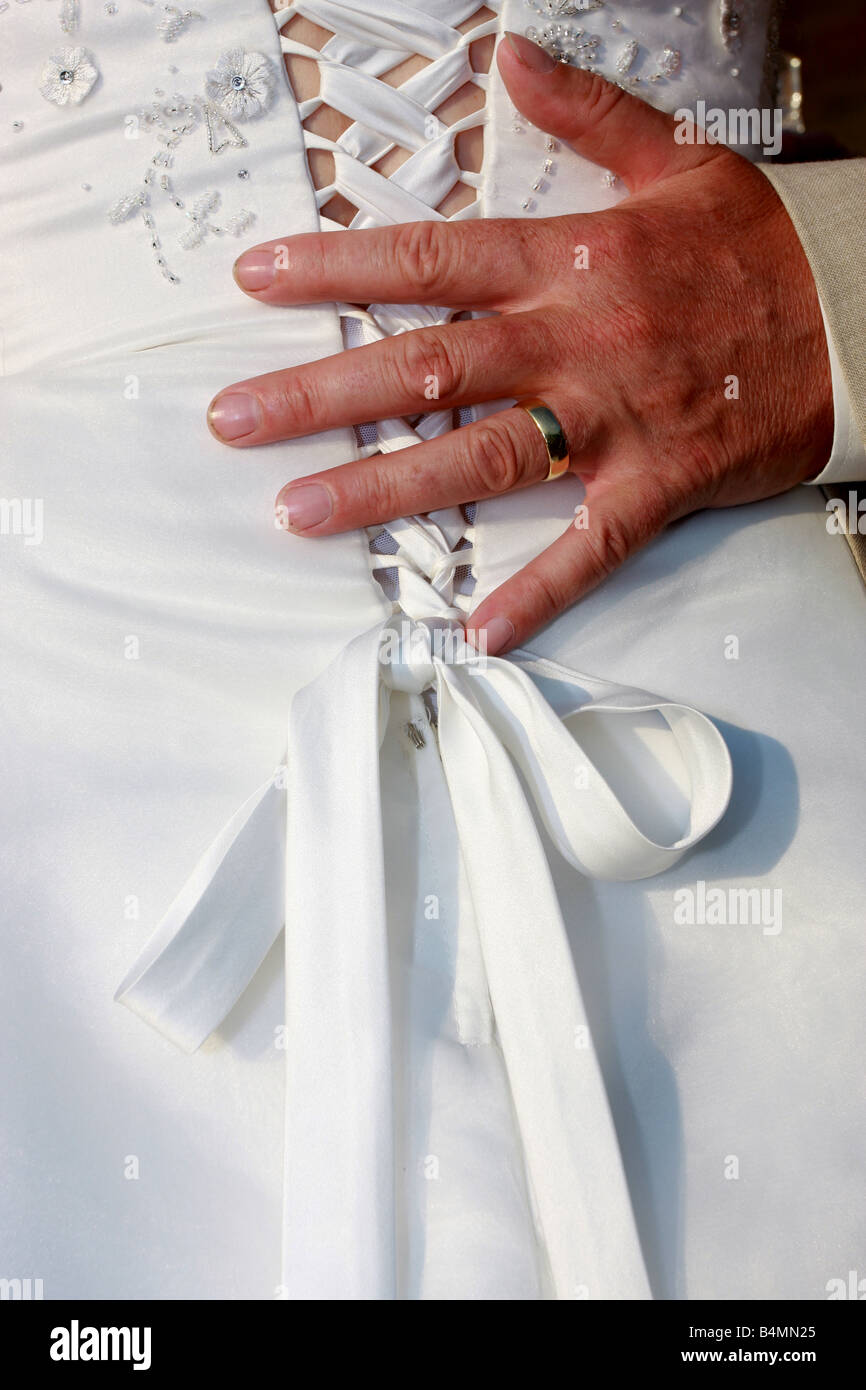 groom hugging his bride Stock Photo - Alamy
