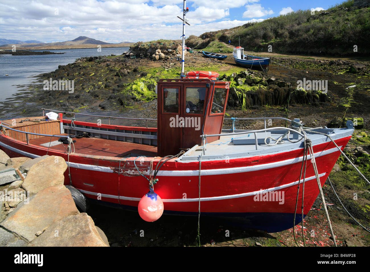 red old fishing boat on Inishnee an island near Roundstone, Connemara ...