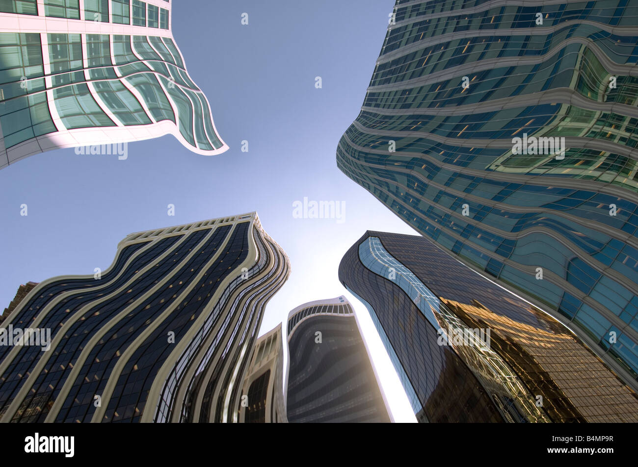 looking up at extremely distorted melting buildings Stock Photo - Alamy