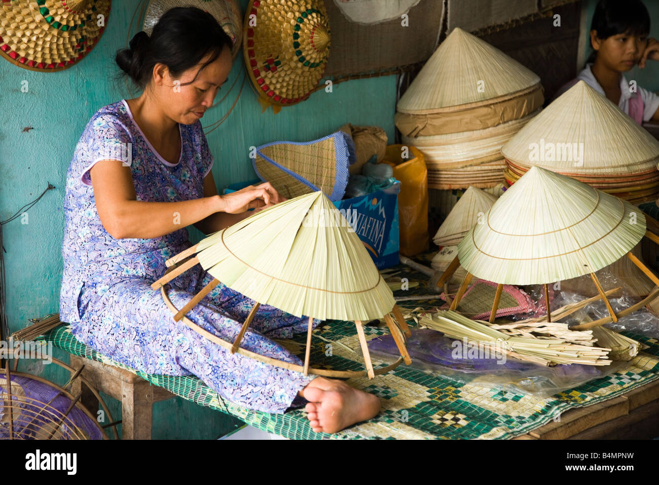 Woman making traditional conical straw hats; Hue, Vietnam Stock Photo ...