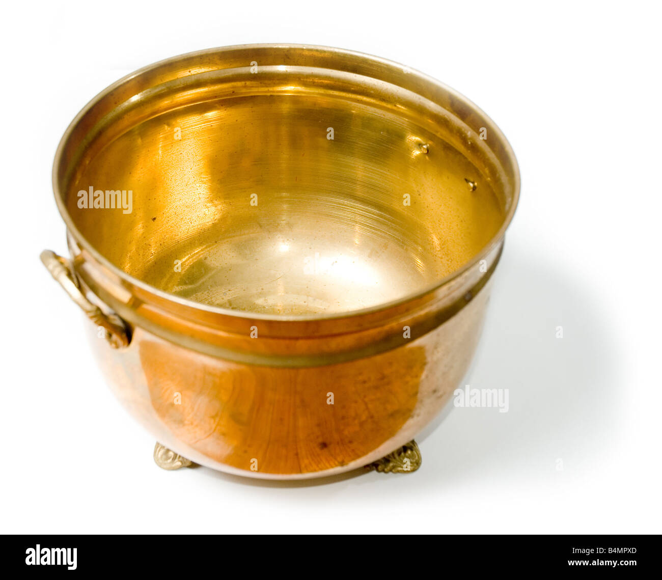 A brass cauldron isolated on a white background Stock Photo - Alamy