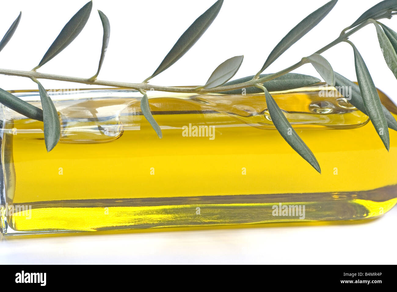 Olive oil and leaves on white background Stock Photo - Alamy