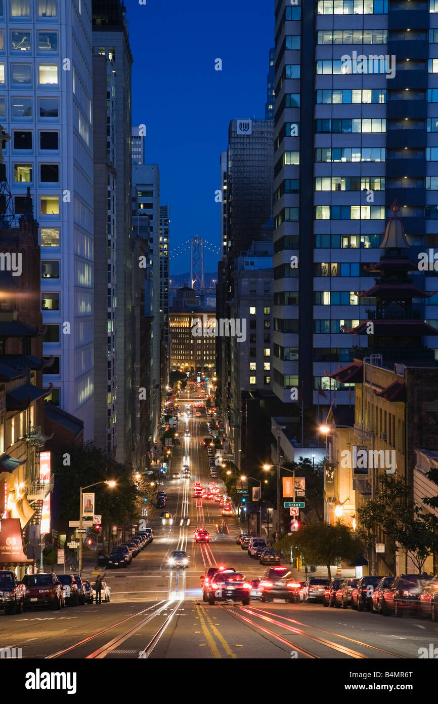 Looking down California Street towards the Bay Bridge during dusk San ...