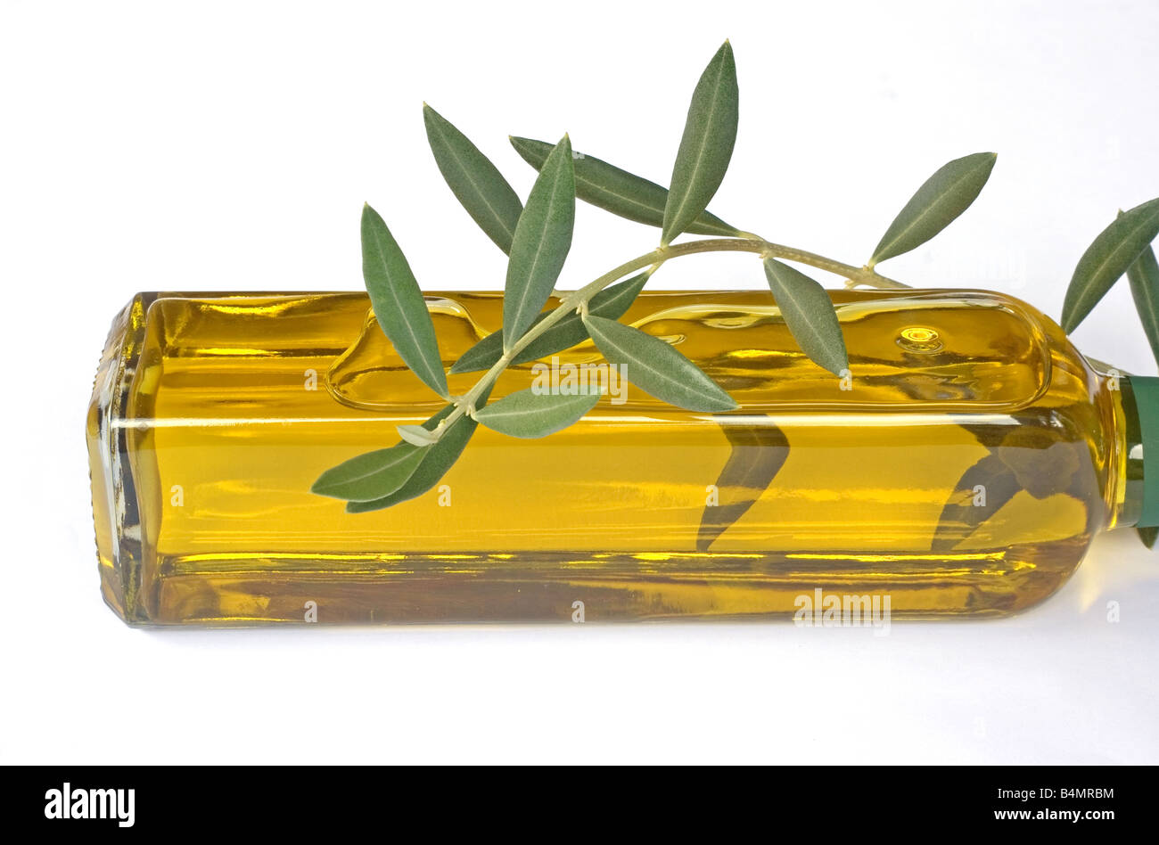 Olive oil and leaves on white background Stock Photo - Alamy